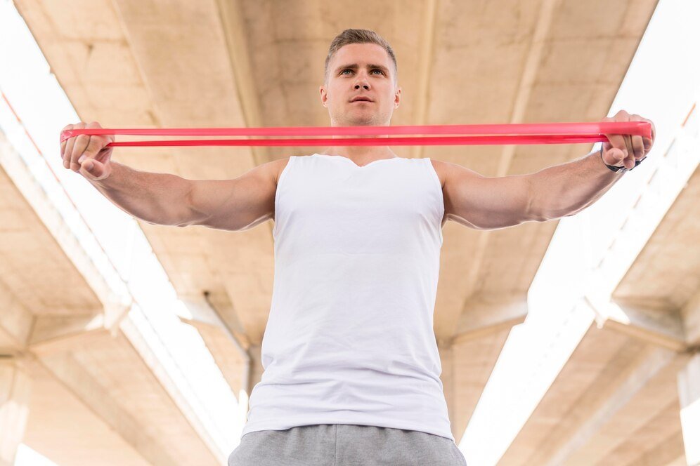 12 Resistance Band Arm Workouts You Can Do in Your Pajamas
